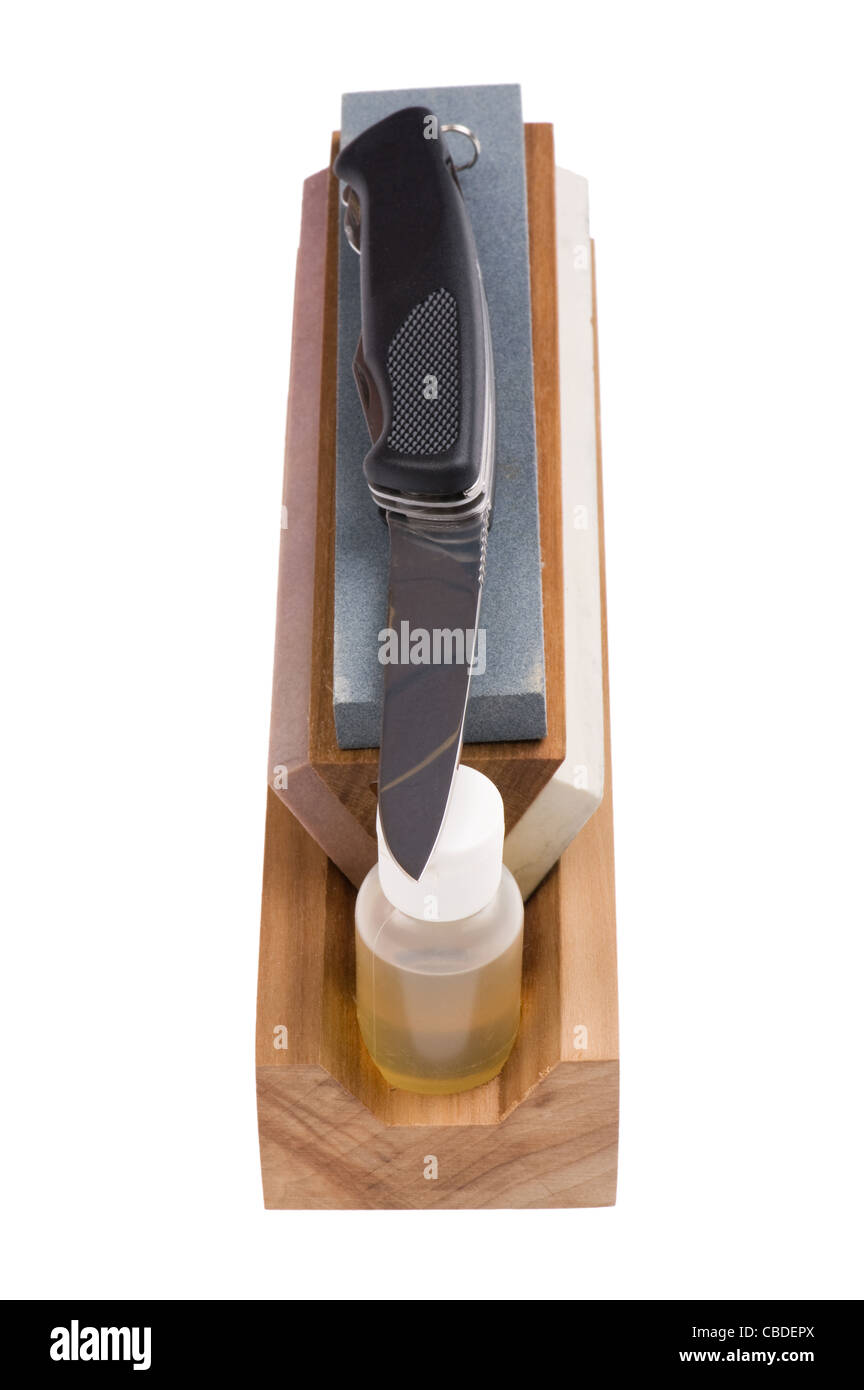 object on white - Sharpener stone and knife Stock Photo - Alamy