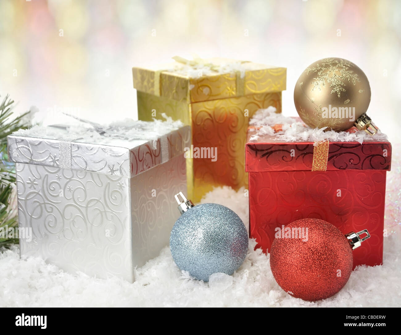 Colorful Christmas decoration and gifts on snow Stock Photo - Alamy