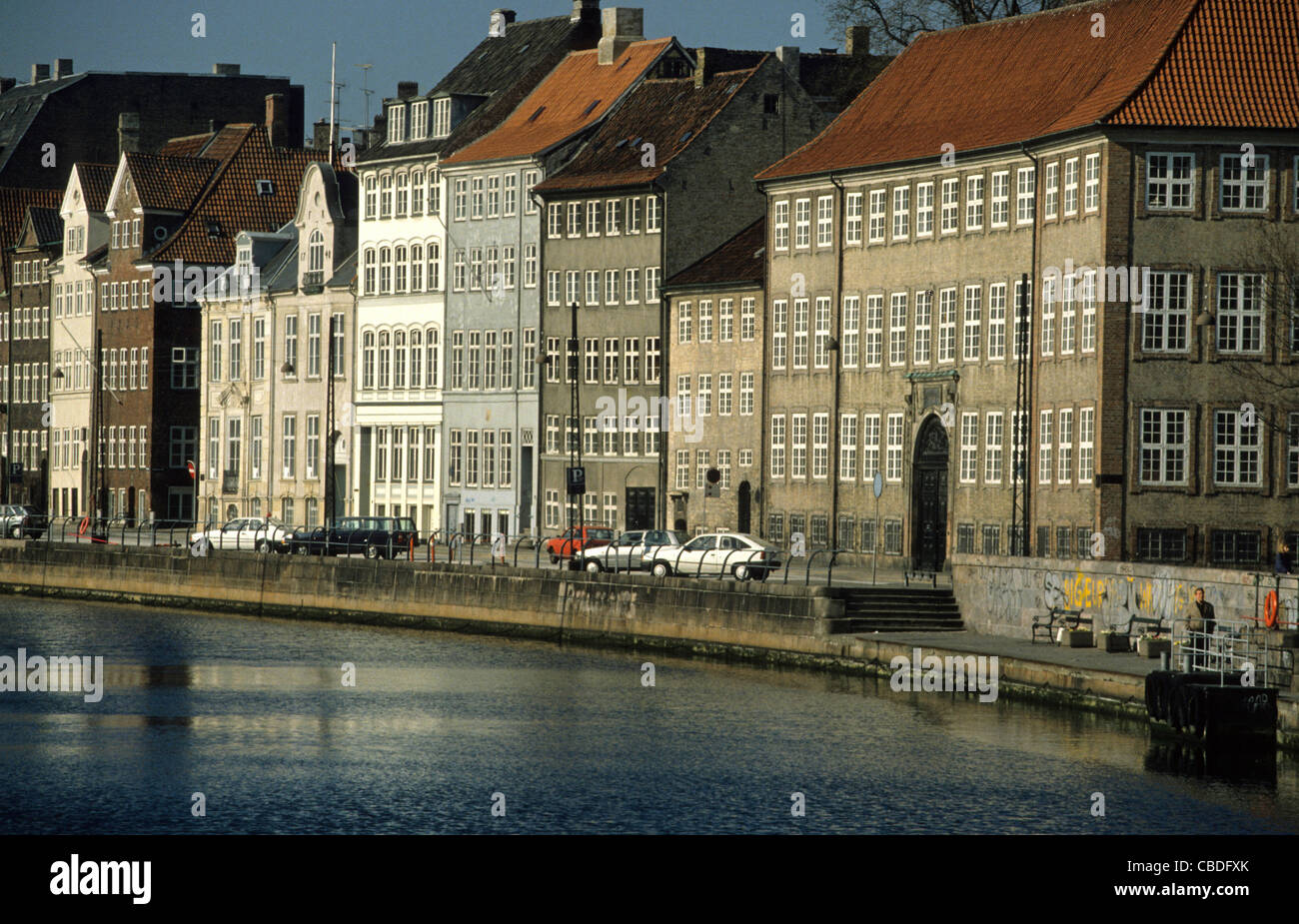 Façade of old buildings along a canal, Copenhagen, Denmark Stock Photo ...