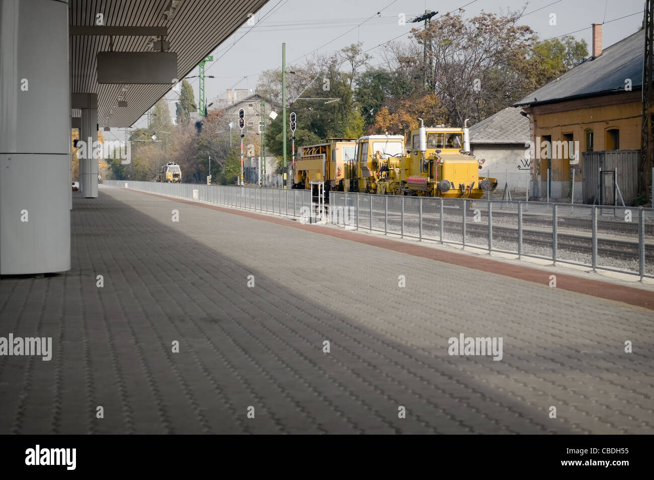 Railway maintenance machine at a railway station Stock Photo - Alamy