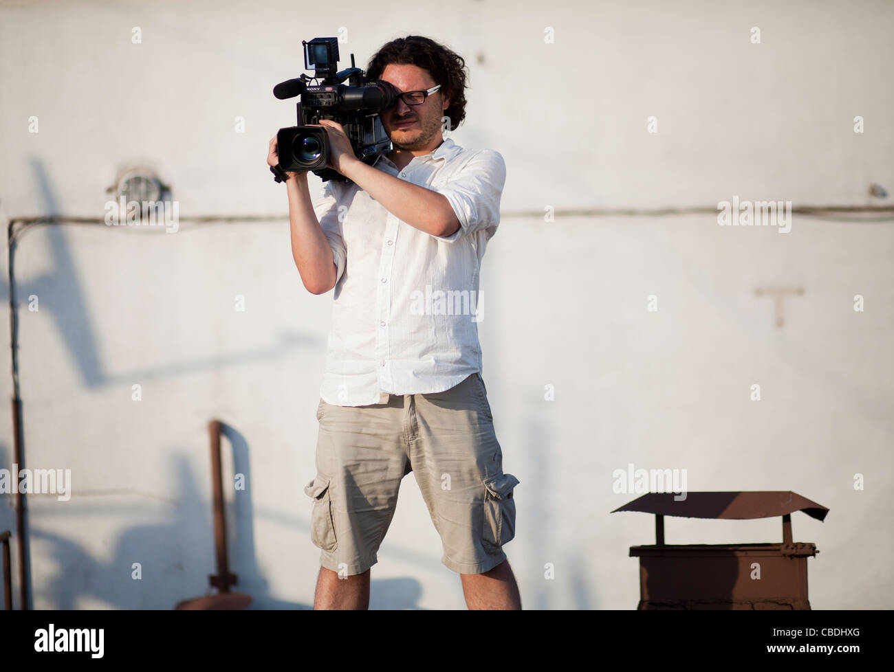 Cameraman with camera. TV, news, journalism, video, recoring, record ...