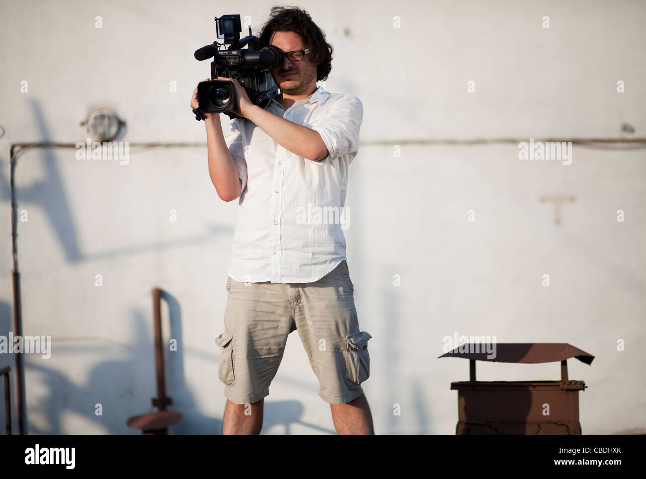 Cameraman with camera. TV, news, journalism, video, recoring, record ...