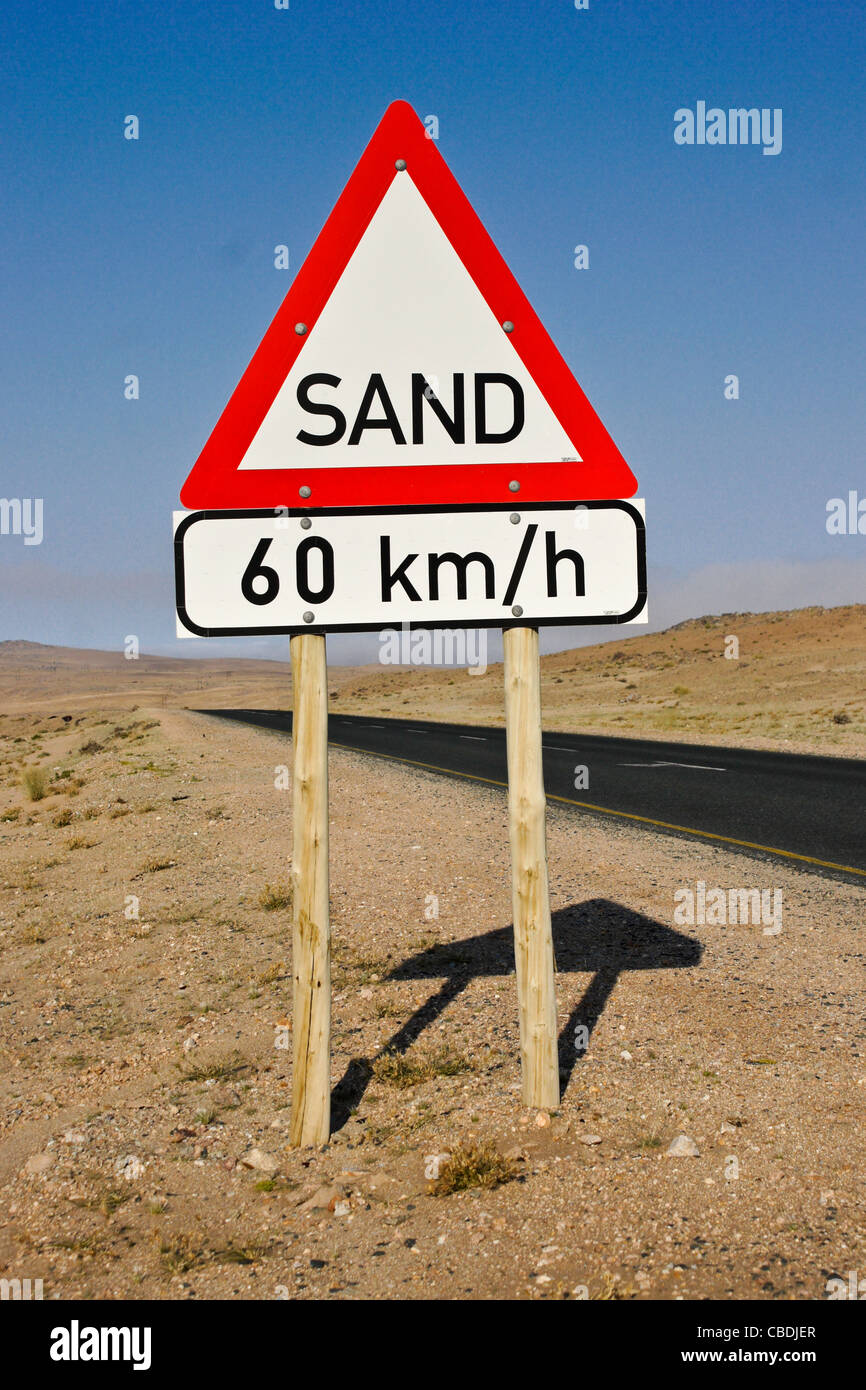 Warning sign on highway, Namibia Stock Photo - Alamy