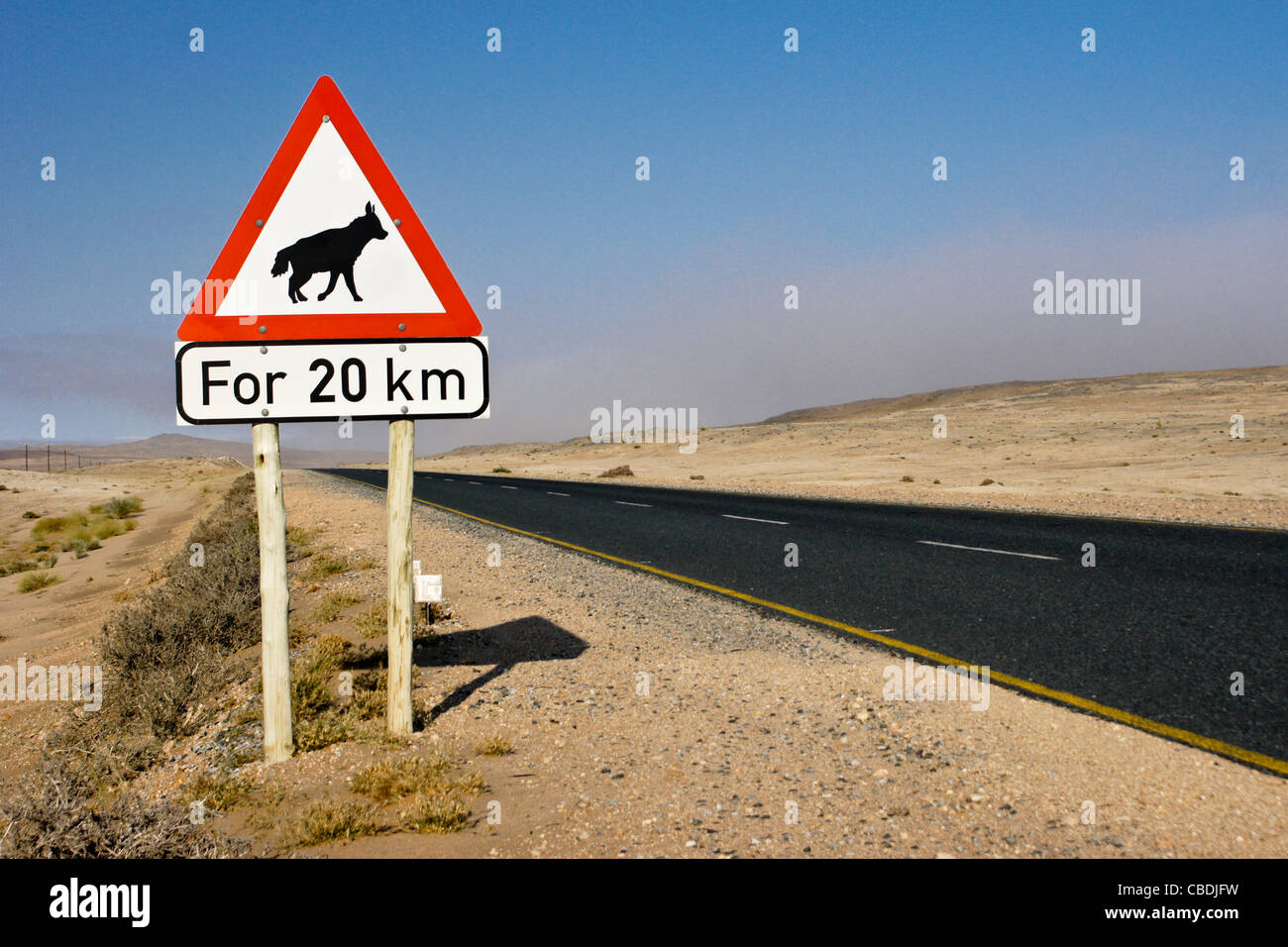Warning sign for brown hyenas on highway, Namibia Stock Photo - Alamy