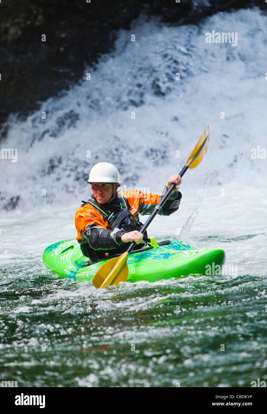 A man kayaking down a series of small waterfalls, Snoqualmie River ...