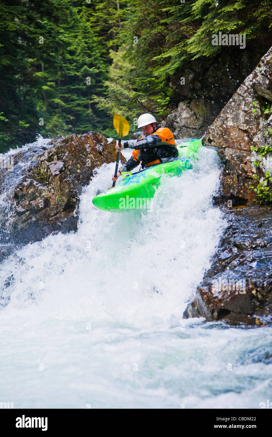 A man kayaking down a series of small waterfalls, Snoqualmie River ...