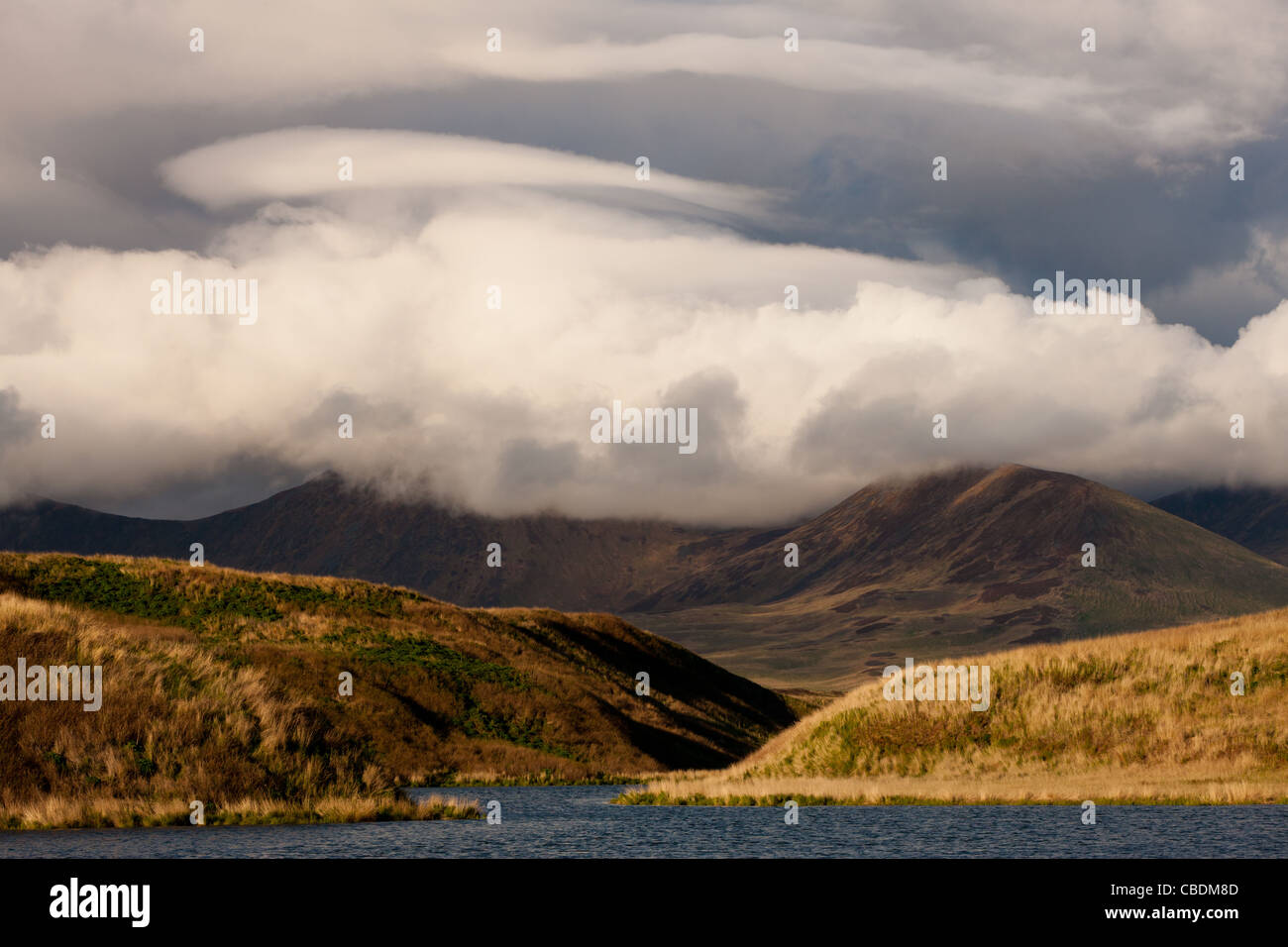 Lenticular Cloud formation over mountain range on Kodiak Island, AK ...