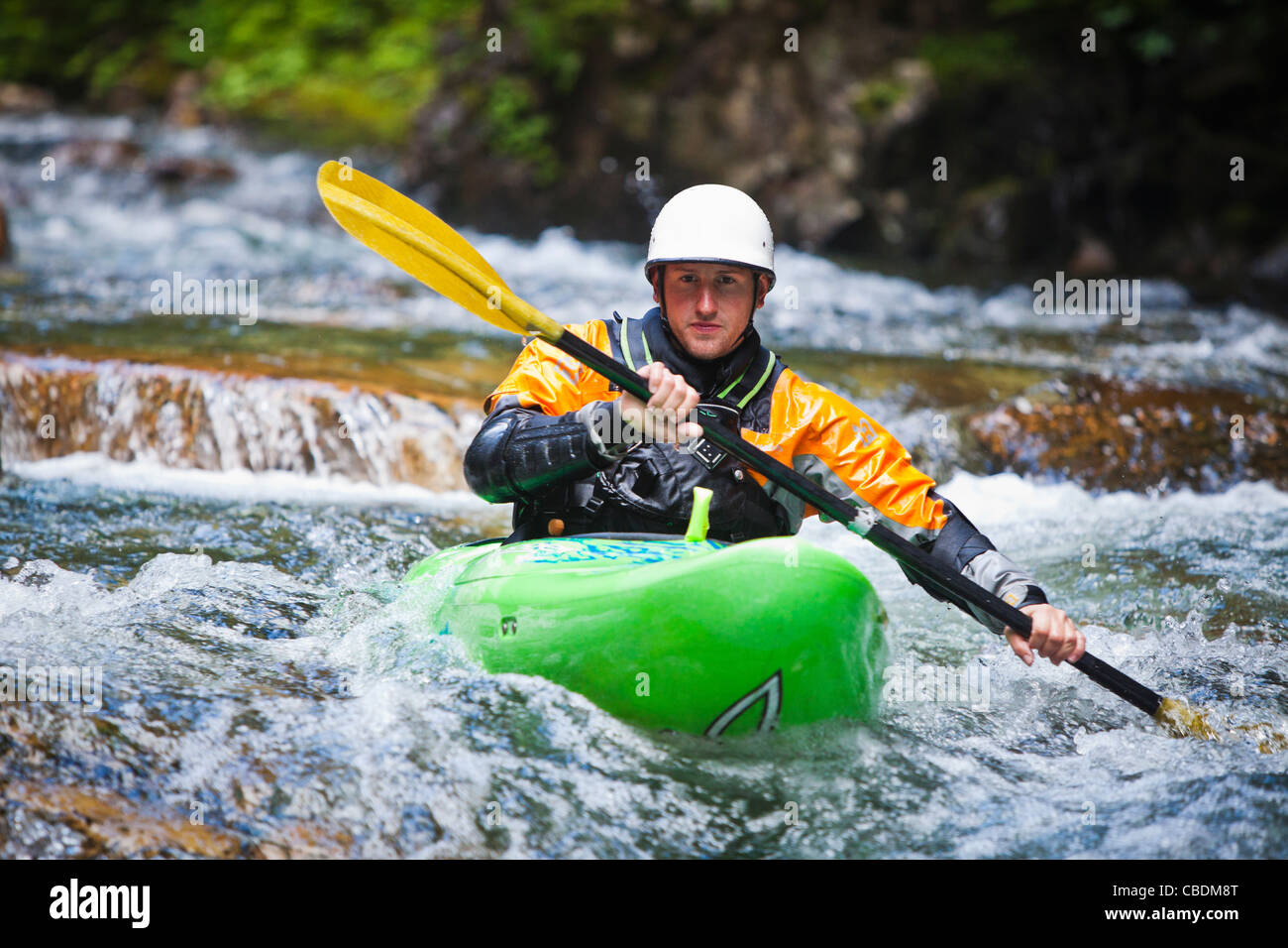 A man kayaking down a series of small waterfalls, Snoqualmie River ...