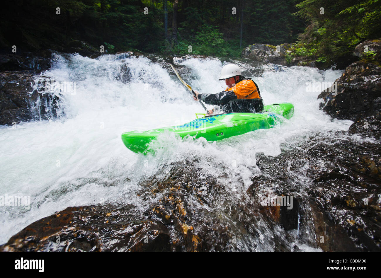 A man kayaking down a series of small waterfalls, Snoqualmie River ...