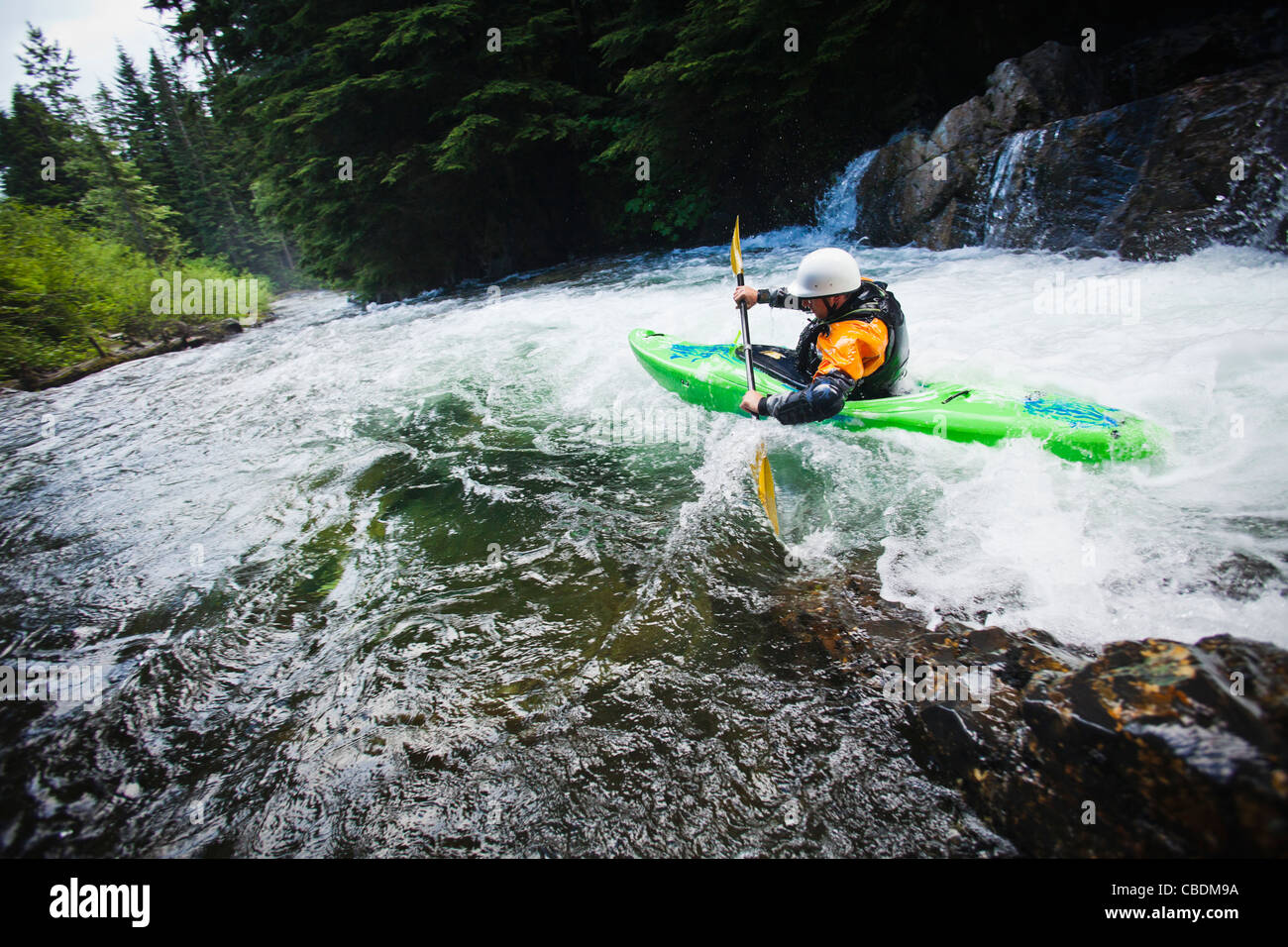 A man kayaking down a series of small waterfalls, Snoqualmie River ...
