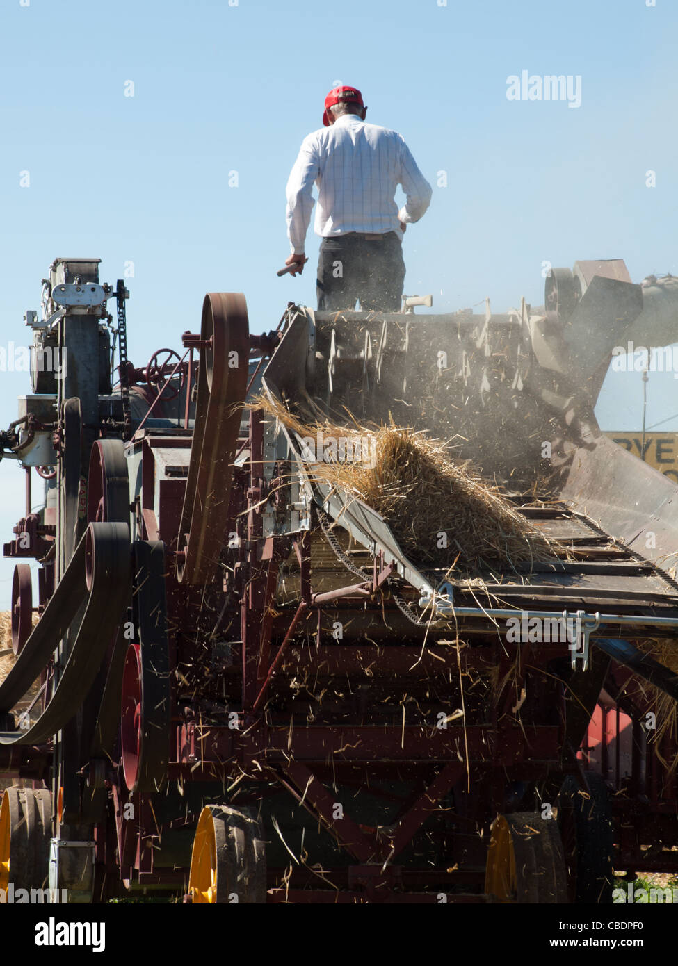 Men harvesting hay with old farm equipment Stock Photo - Alamy