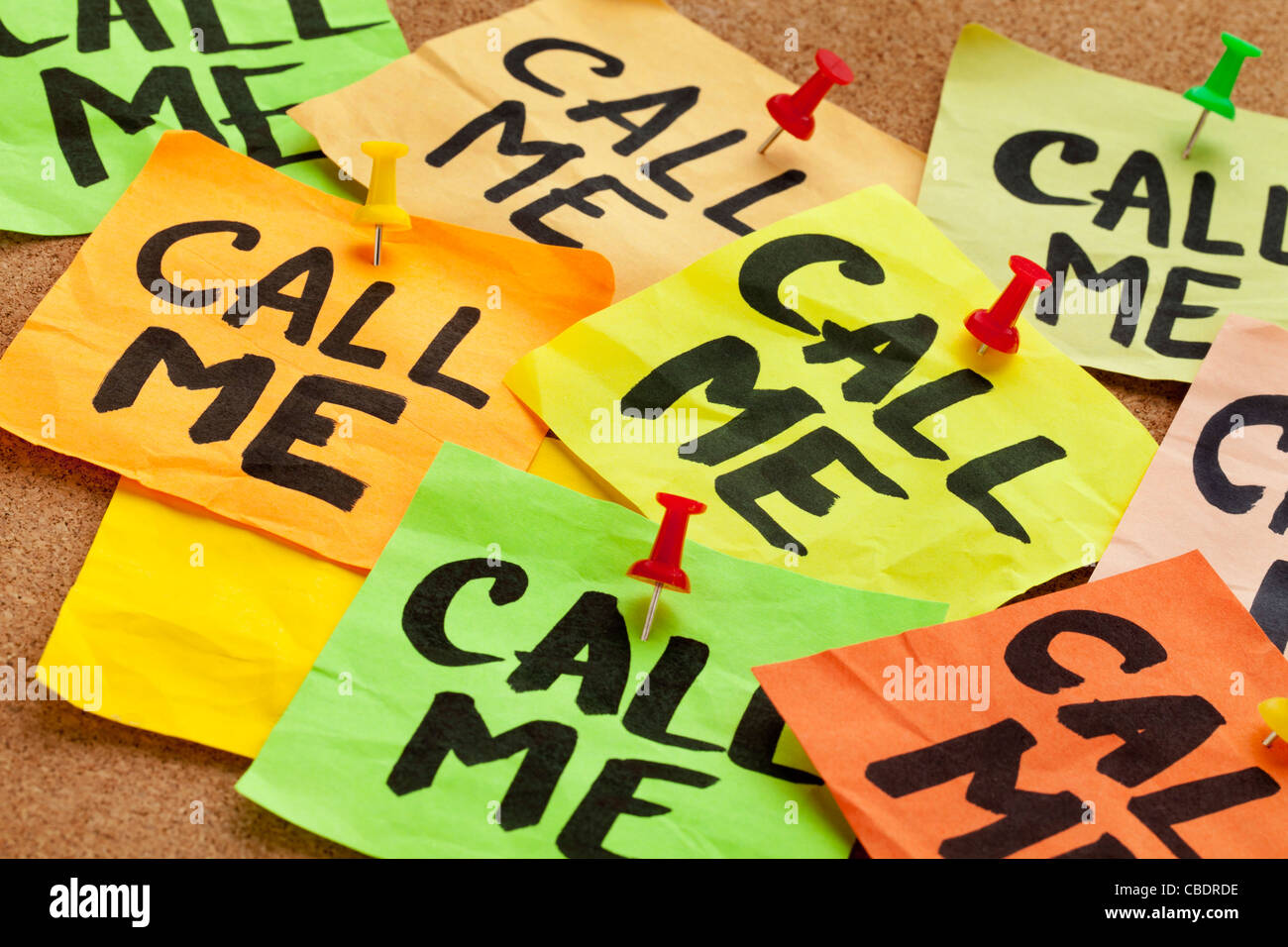 call me - several sticky notes on cork bulletin board with a reminder ...