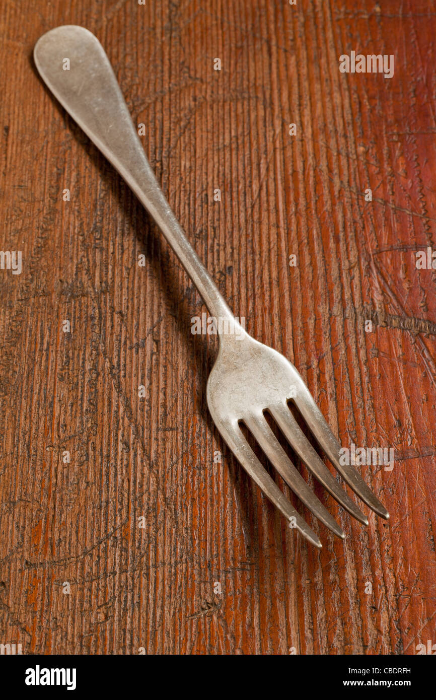 vintage fork on scratched grunge wood surface Stock Photo - Alamy