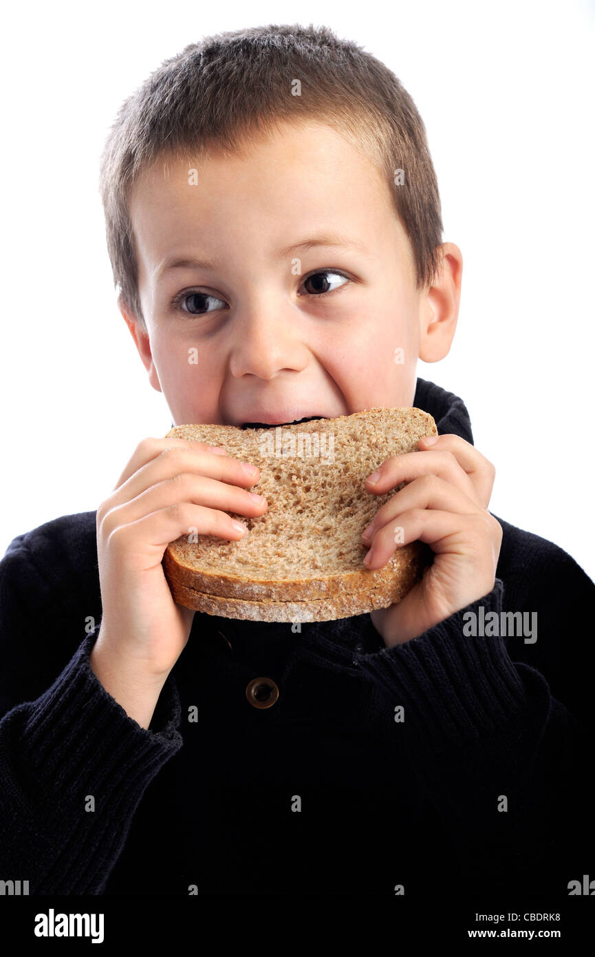 boy eating slices of brow bread Stock Photo - Alamy
