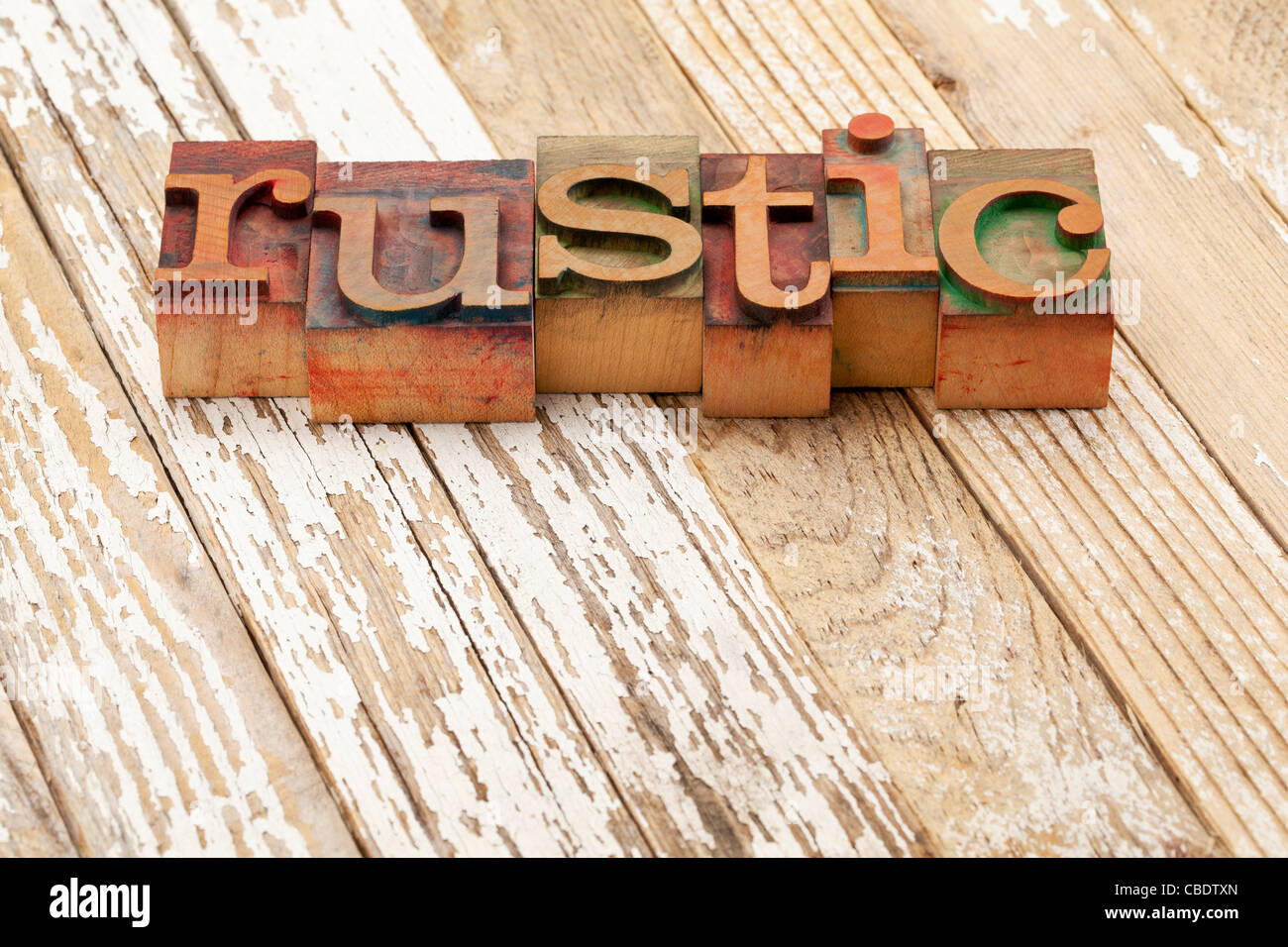 rustic word in vintage letterpress printing blocks against old grunge ...