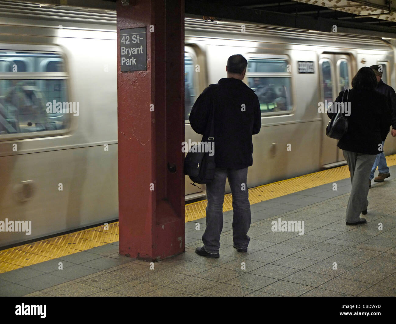 Waiting for subway train on platform Stock Photo - Alamy