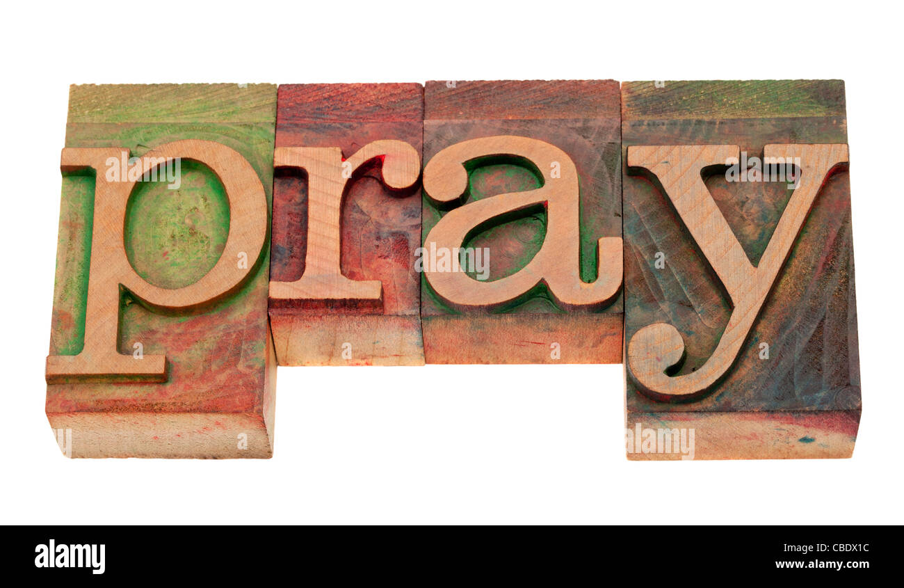 pray word in vintage wooden letterpress printing blocks, stained by ...