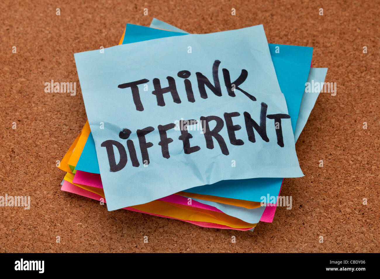 think different concept - motivational phrase on a stack of sticky ...