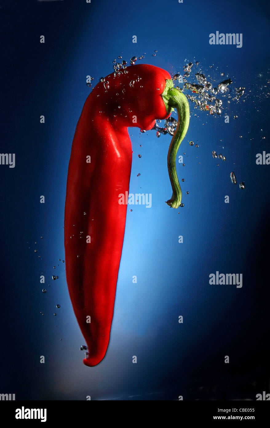 red raw pepper diving Stock Photo - Alamy