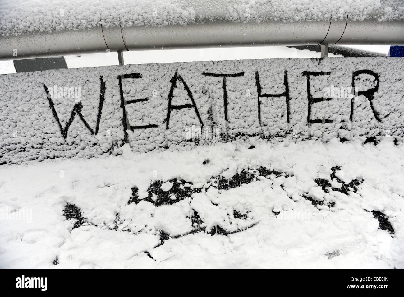 The word weather written in the snow in SE1 London Stock Photo - Alamy