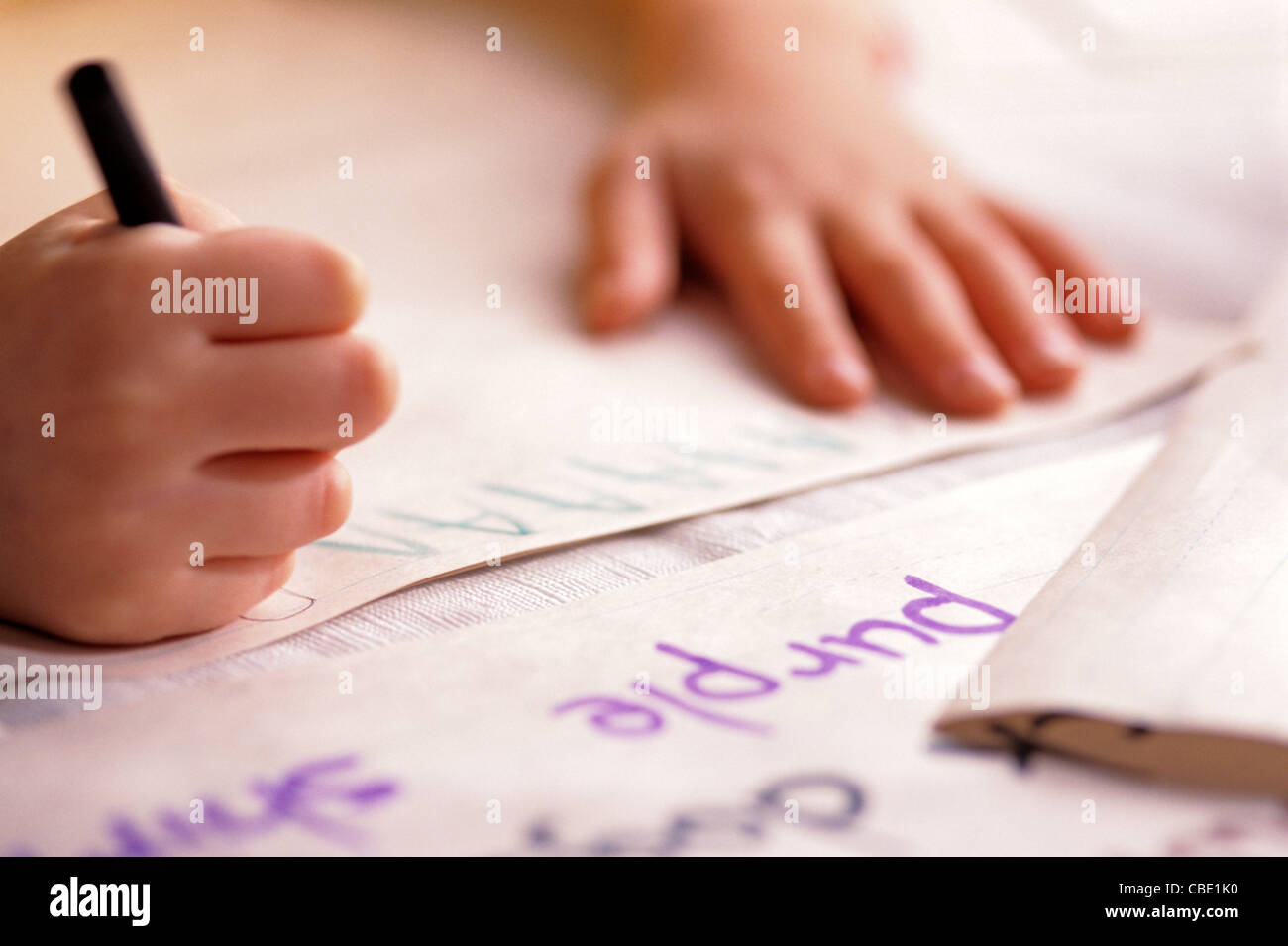 Young girl 7 years old writing at school Stock Photo - Alamy