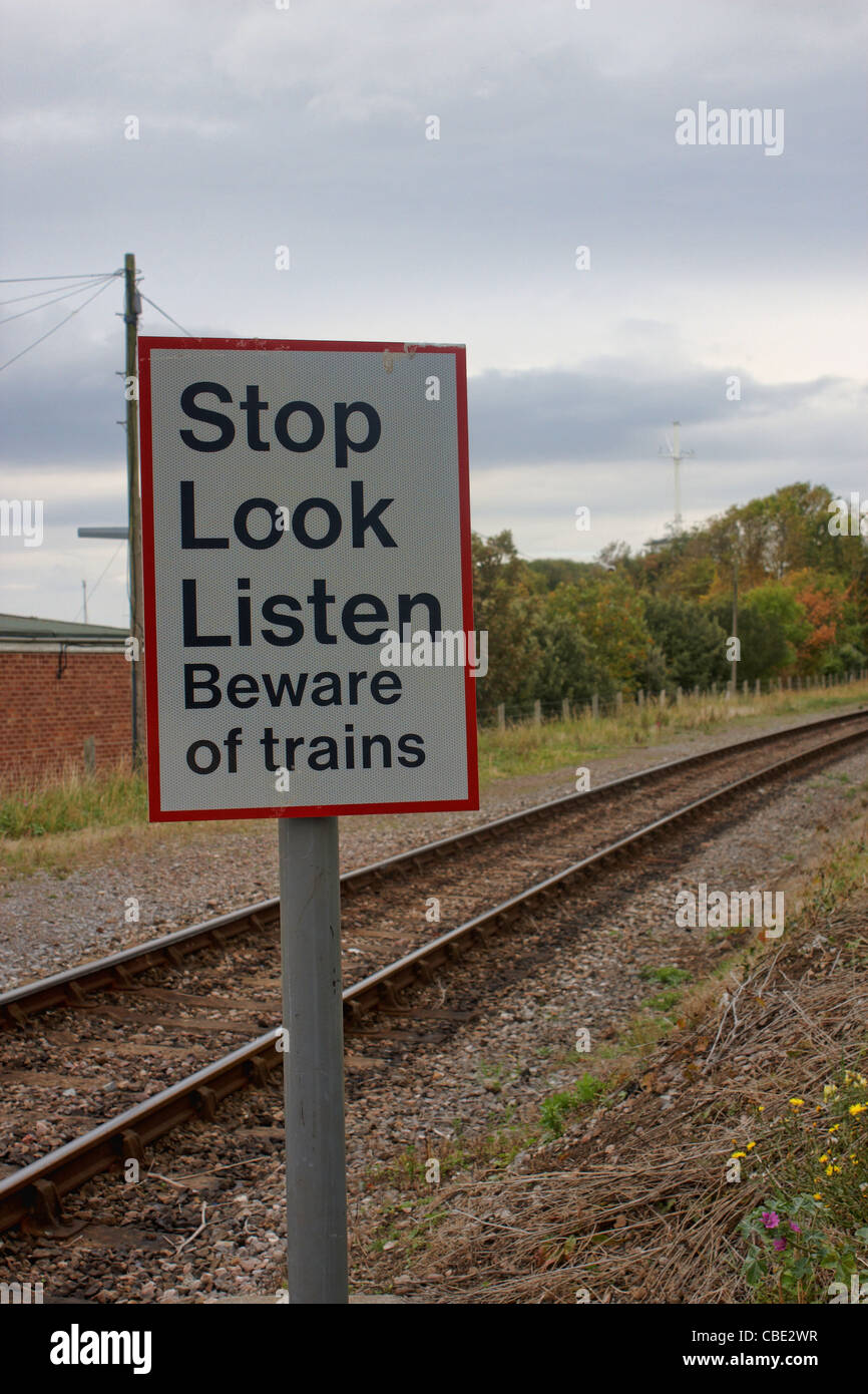 A warning sign on a railway line Stock Photo - Alamy