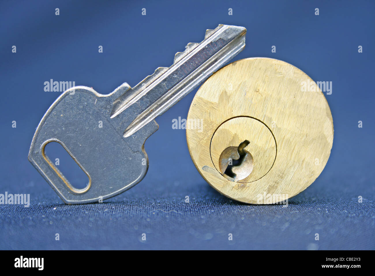 Key and cylinder lock on a plain background Stock Photo - Alamy