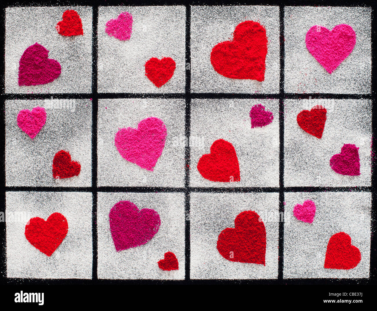 Coloured powder heart shape pattern Stock Photo - Alamy