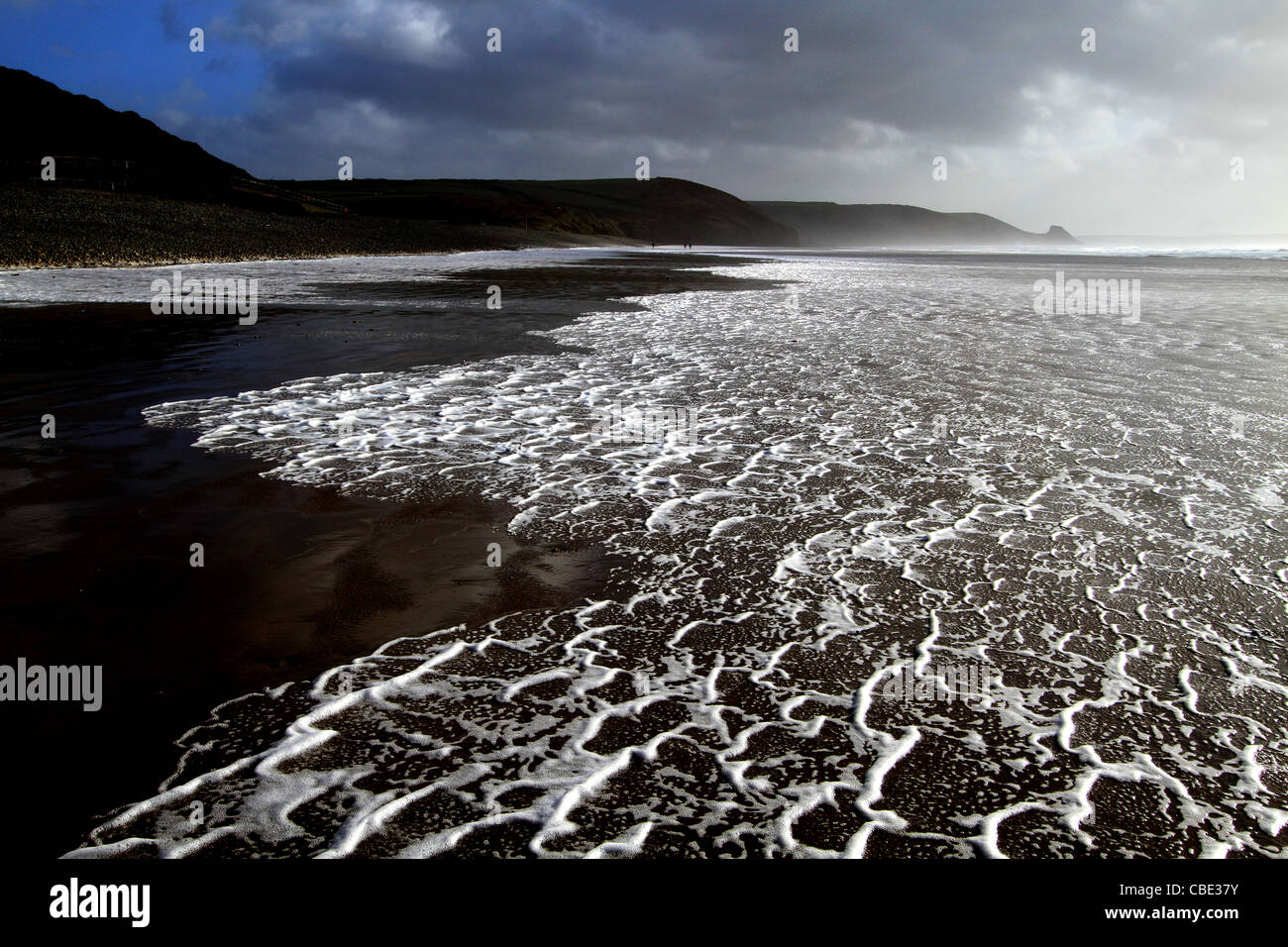 Surf being blown up the beach at Newgale, Pembrokeshire, West Wales ...