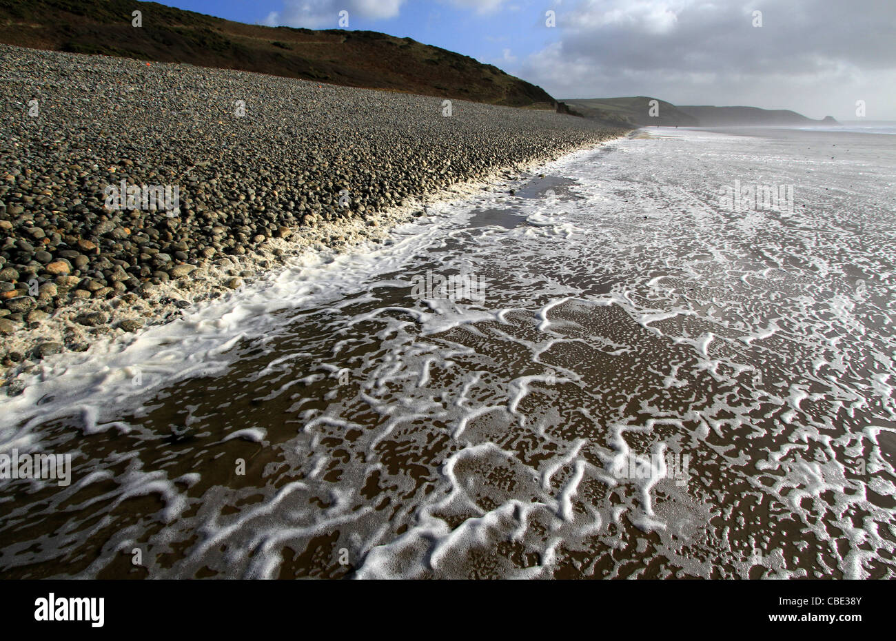 Surf being blown up the beach at Newgale, Pembrokeshire, West Wales ...
