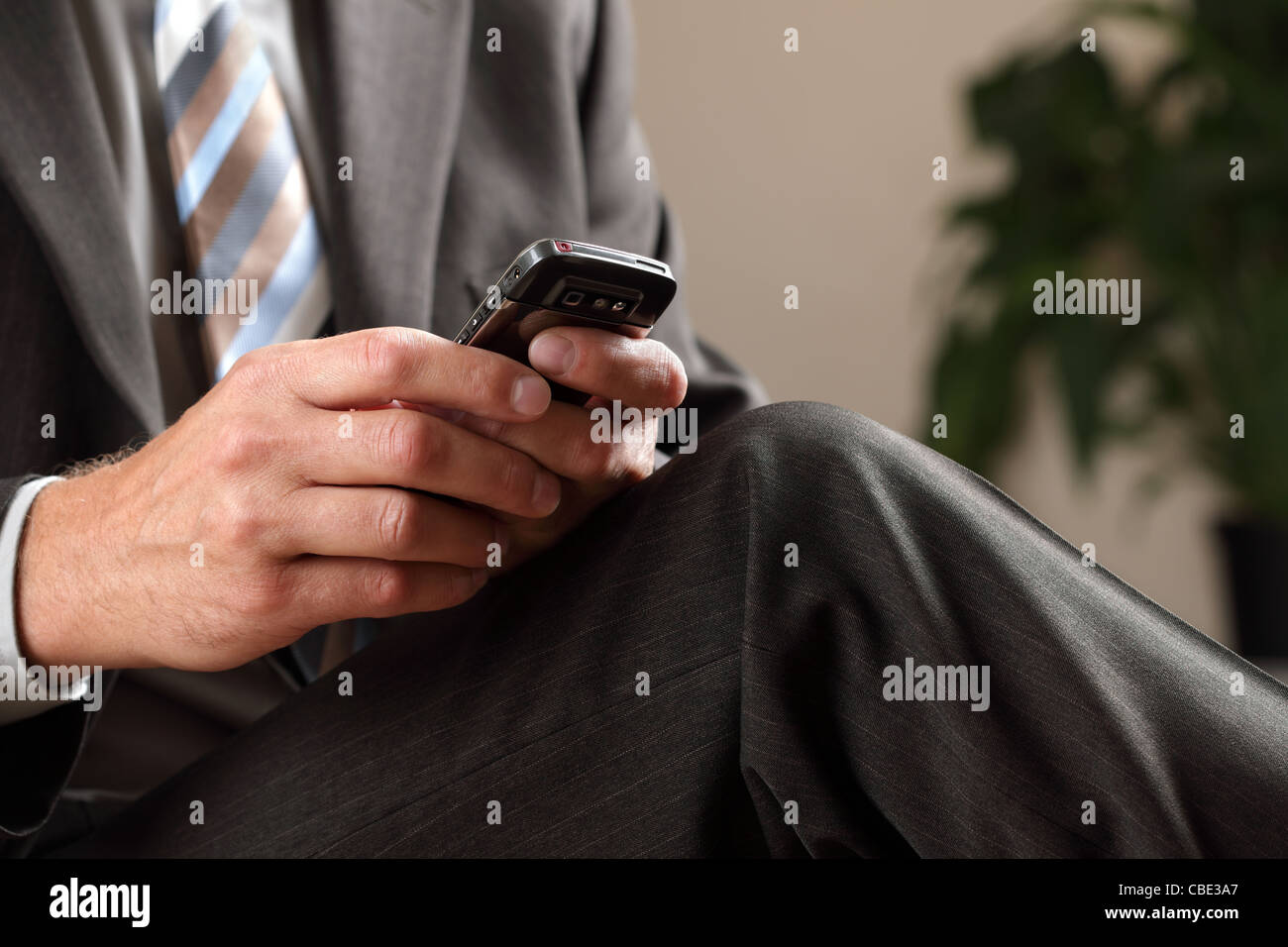 Business man text messaging Stock Photo - Alamy