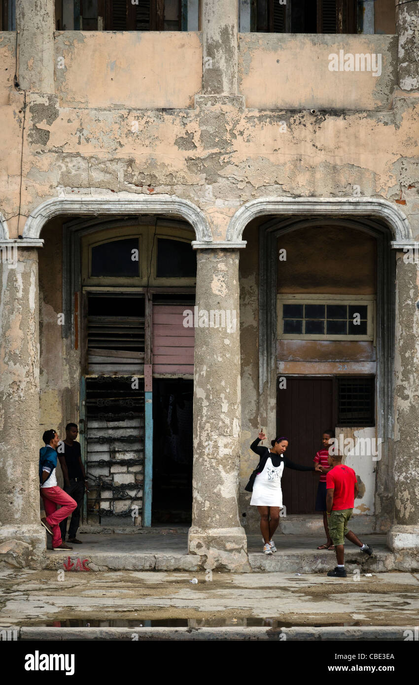 People chatting outside a run down building Habana Vieja Havana Cuba ...