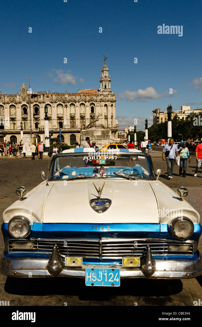 Old American Ford car parked with Cuban National Theatre in the ...