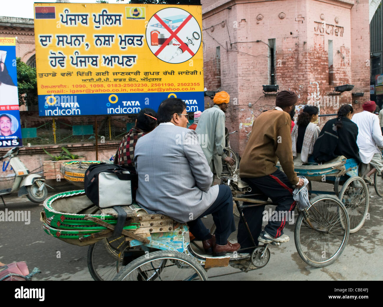Busy street packed with cycle rickshaws and people is a common scene in ...