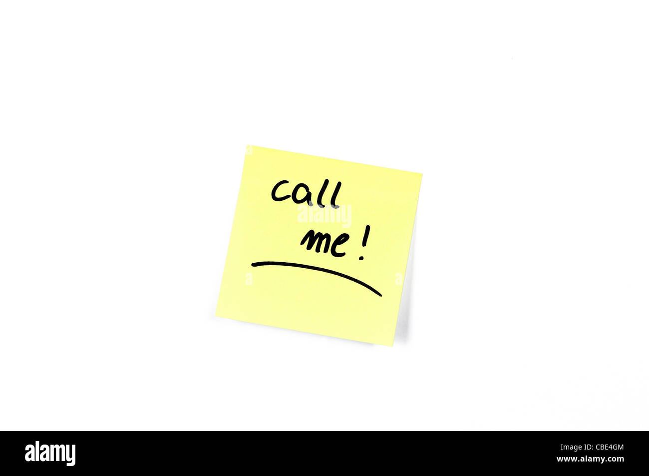 yellow memo card on a white background Stock Photo - Alamy