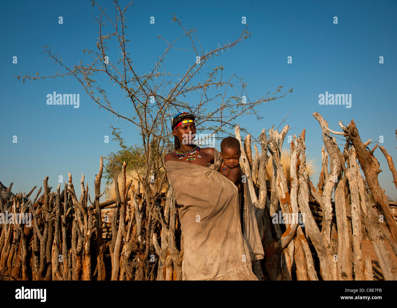 Mucawana Woman With Her Baby In Her Arms, Village Of Mahine, Angola ...