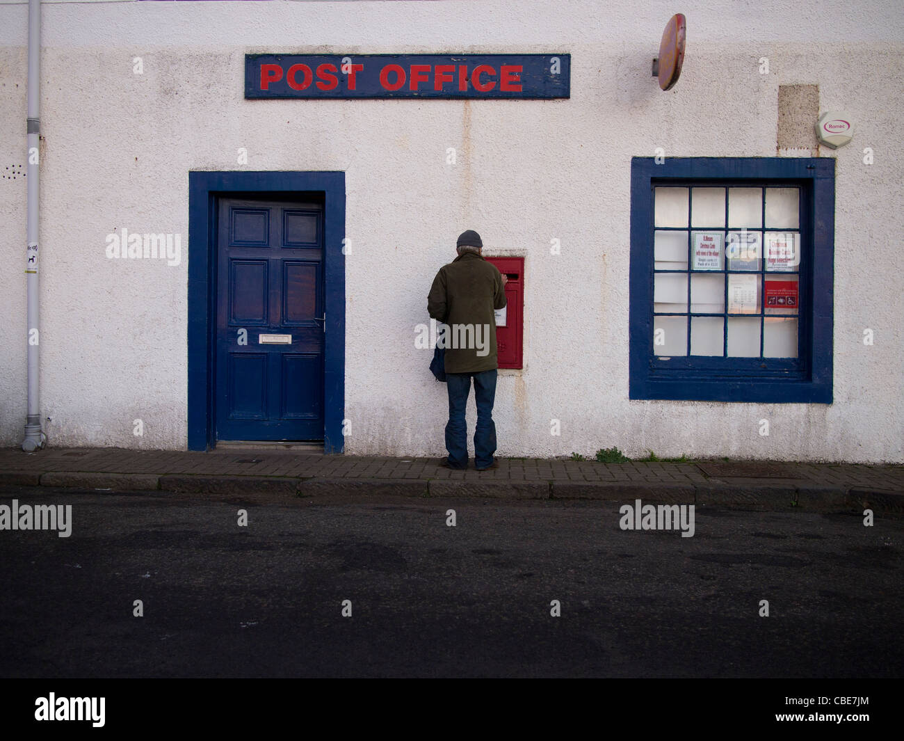 Man Posting a Letter in Post Box, St Monans, Fife Stock Photo - Alamy