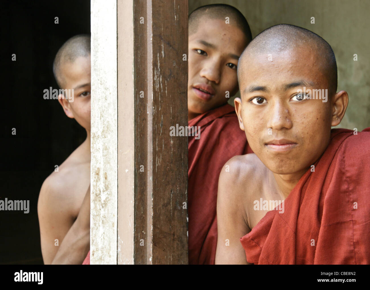 3 boy monks at a monastery in Myanmar Stock Photo - Alamy