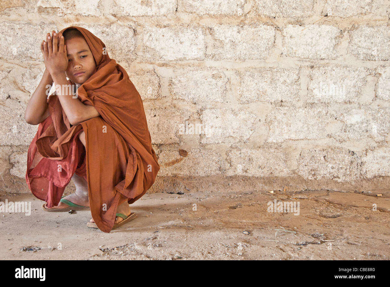 boy monk praying in a temple in Myanmar Stock Photo - Alamy