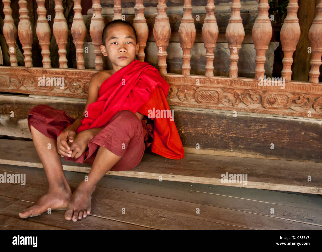 Boy monk sitting in a temple in Myanmar Burma Stock Photo - Alamy