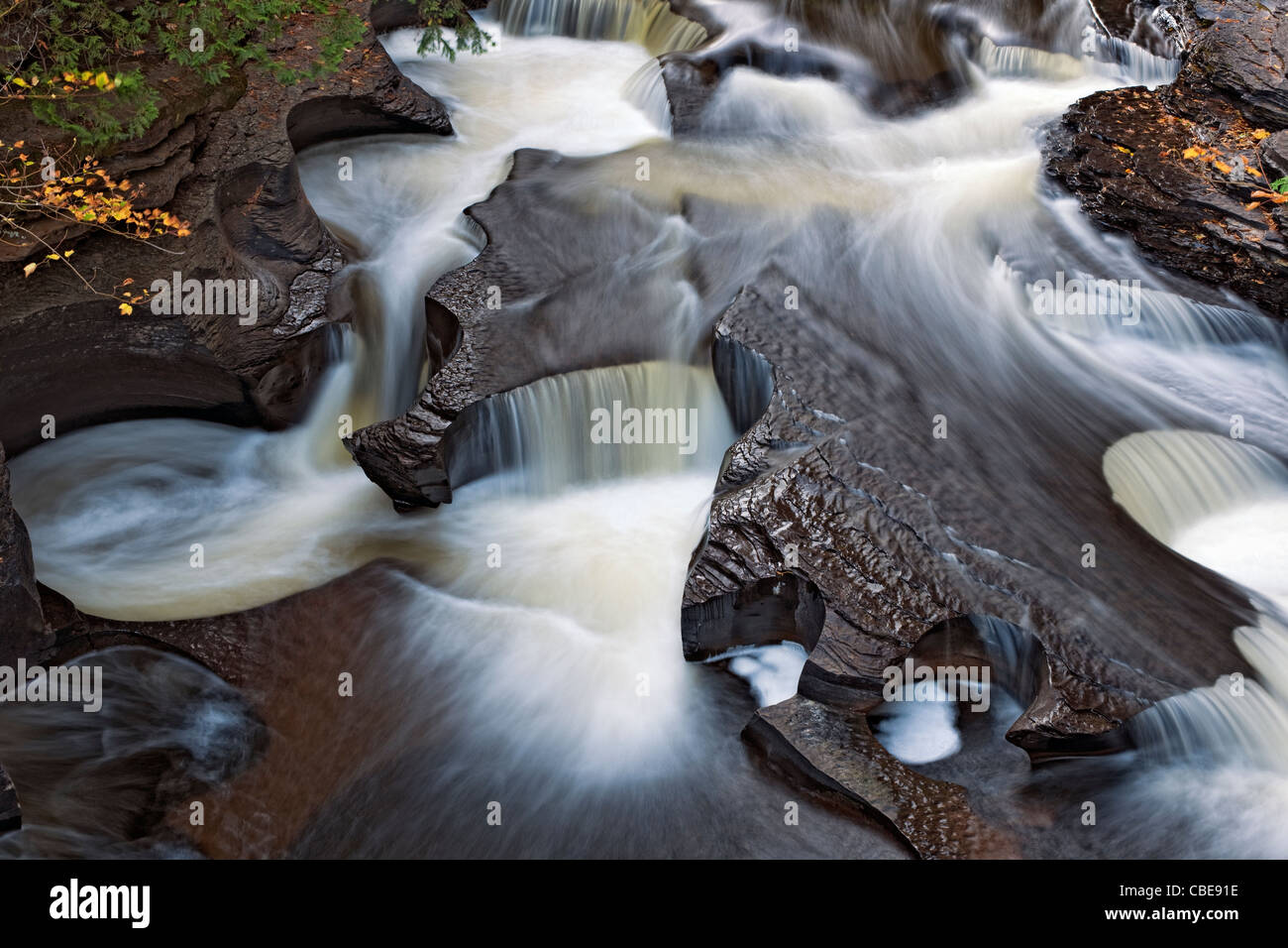 The Wild and Scenic Presque Isle River creates these Potholes among the ...