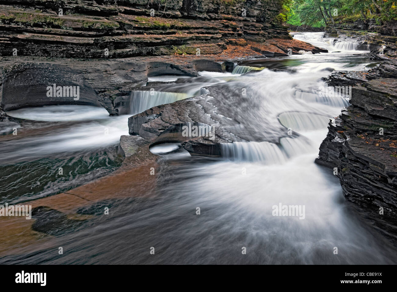 The Wild and Scenic Presque Isle River creates these Potholes among the ...