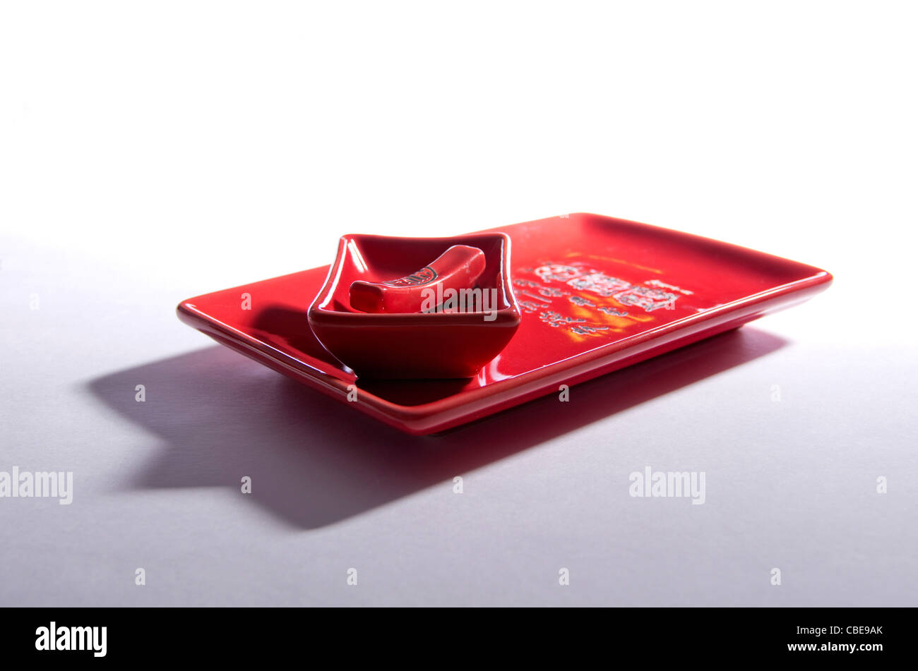 Red sushi plates Stock Photo - Alamy