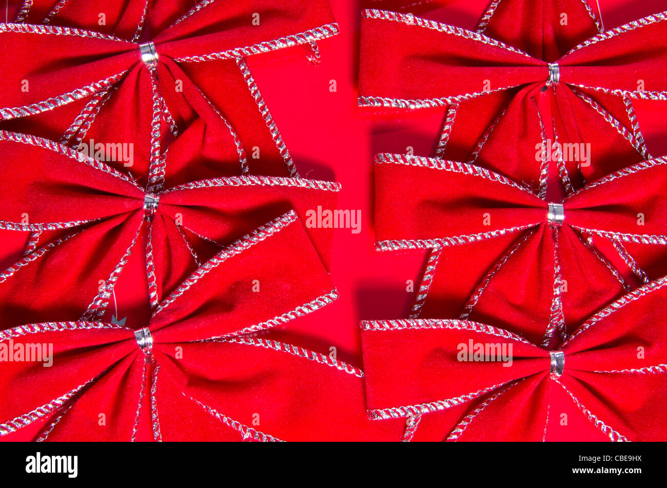 Red bows on a red background Stock Photo - Alamy