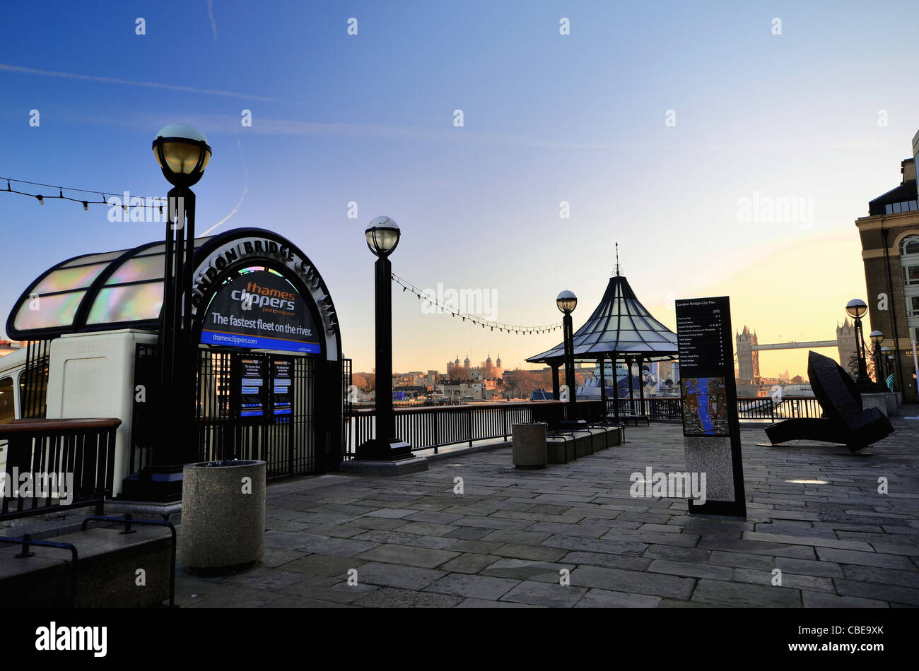 Promenade at London Bridge at sunrise Stock Photo - Alamy