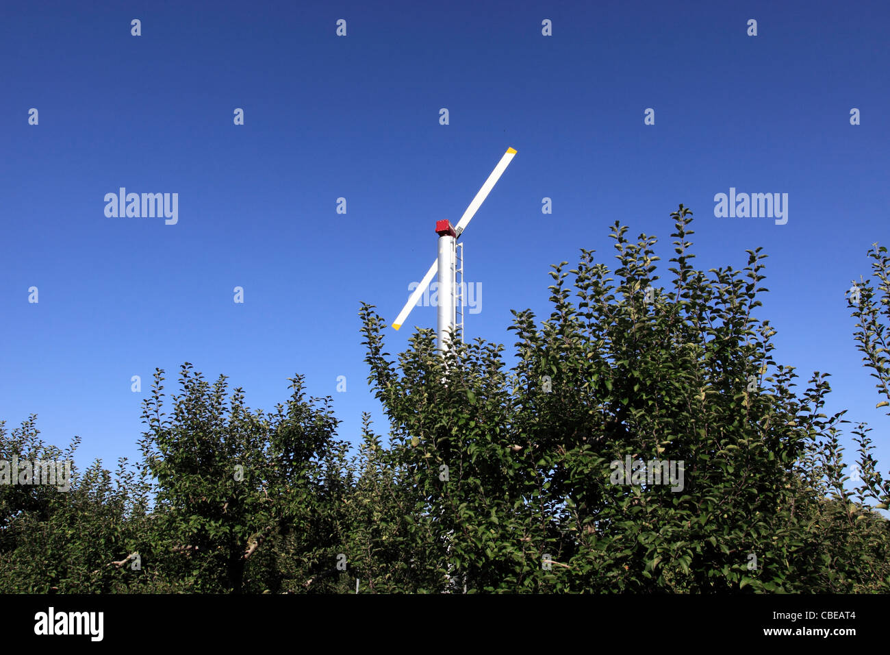 Windmill in apple orchard upstate New York Stock Photo - Alamy