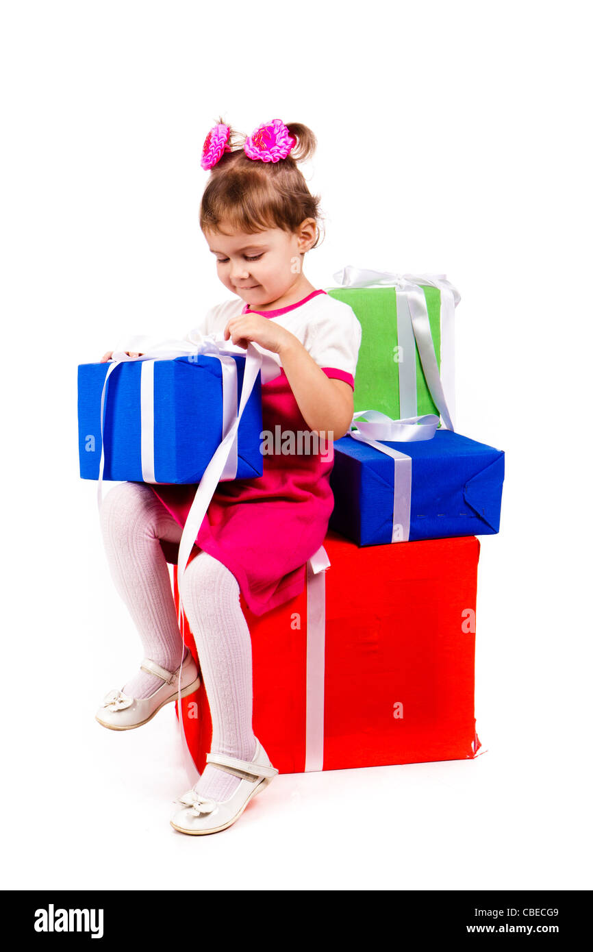 Little girl with gift boxes isolated on white Stock Photo - Alamy