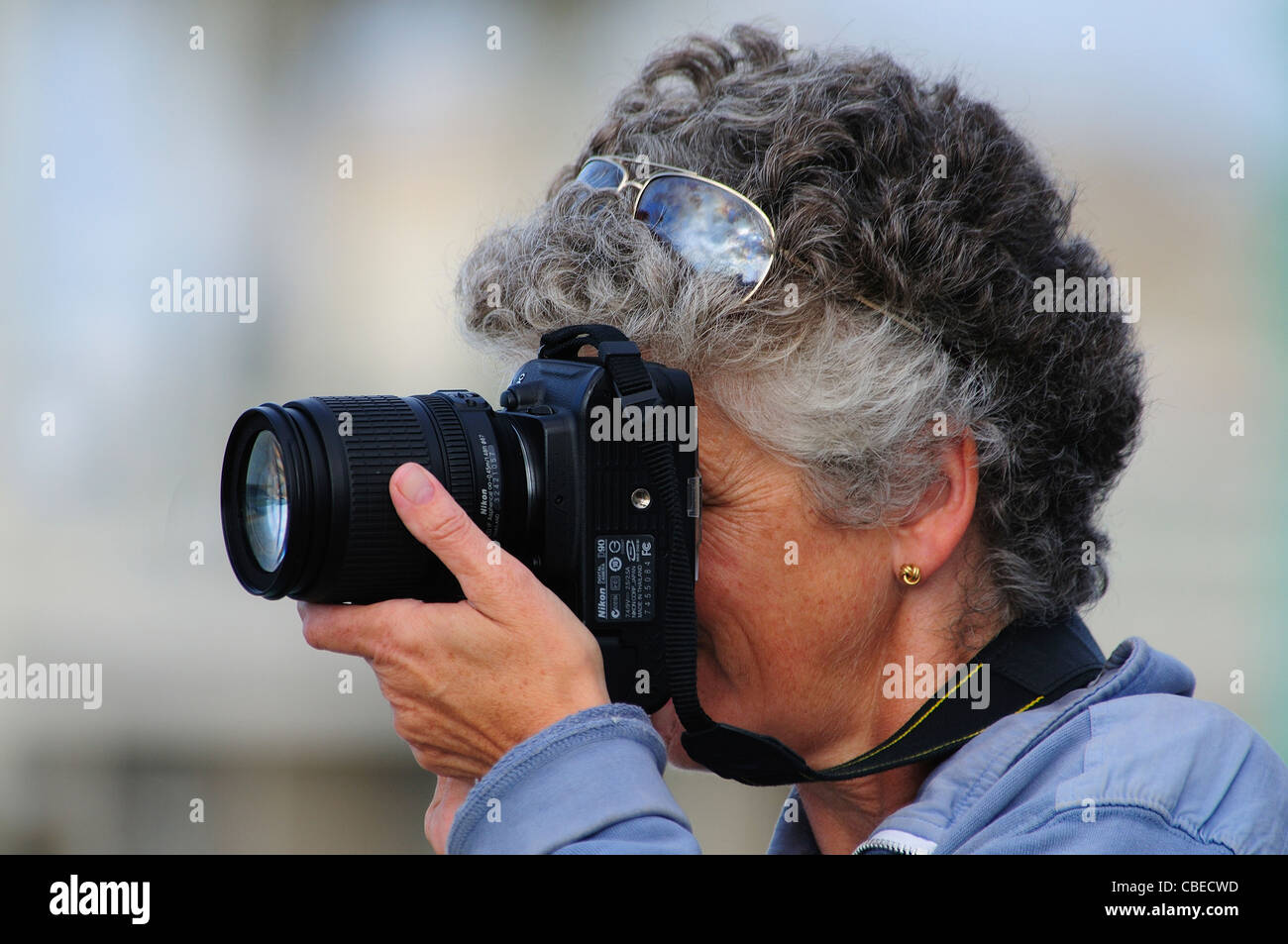 A lady photographer with her camera UK Stock Photo - Alamy