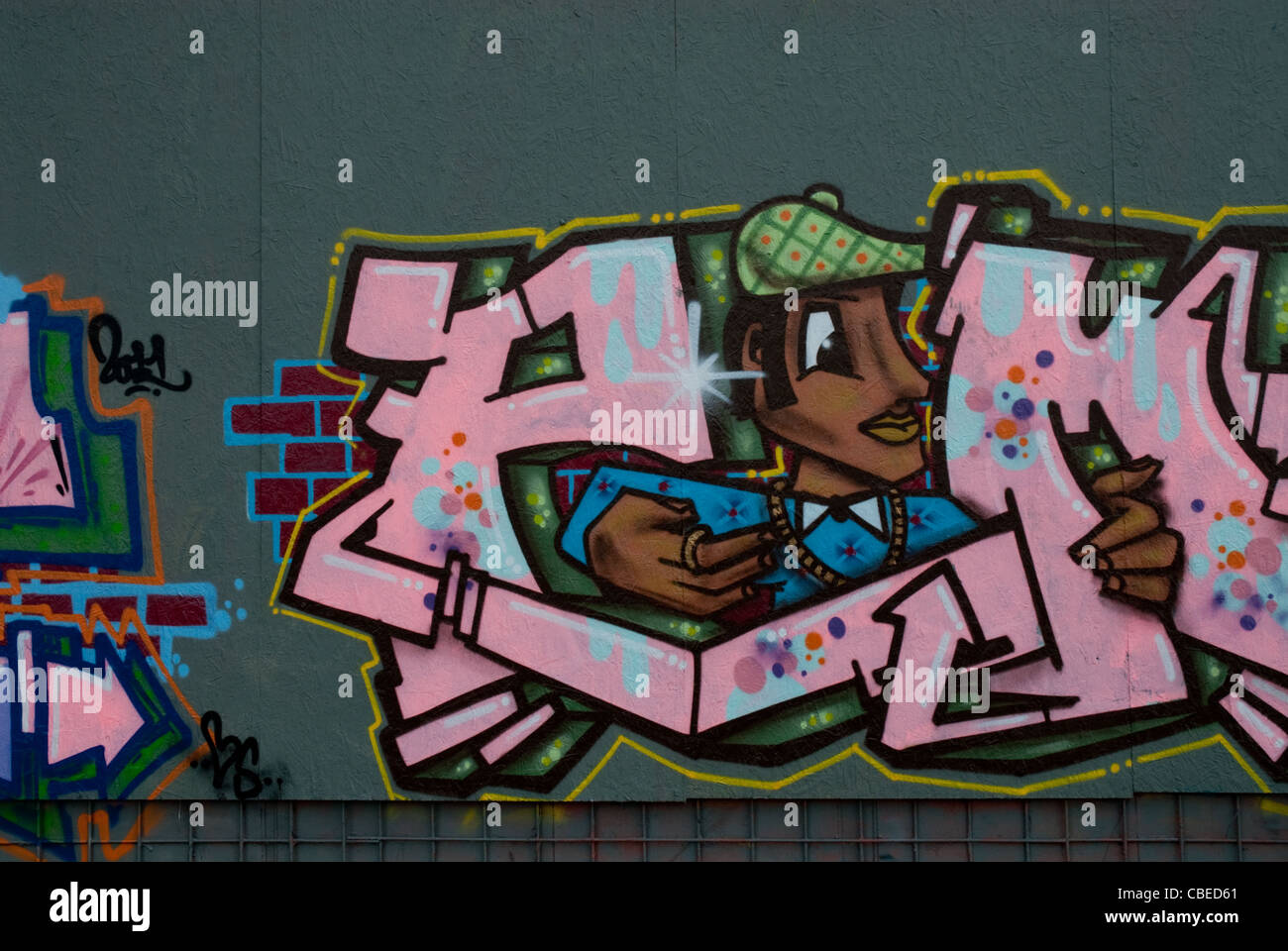 Man in cap as centre of graffiti filled wall Stock Photo - Alamy