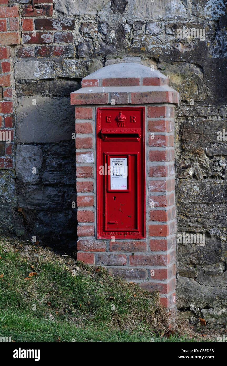 A red post box in a rural village UK Stock Photo - Alamy